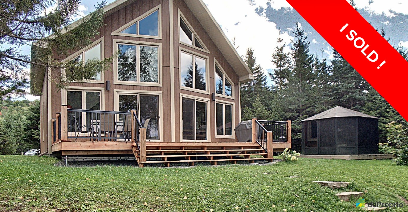 facade-chalet-lac-aux-sables-1600-11537497-sold.jpg